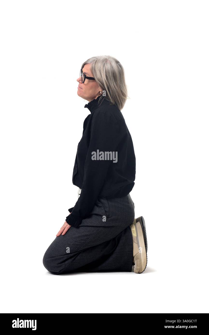 side woman kneeling on white background Stock Photo - Alamy