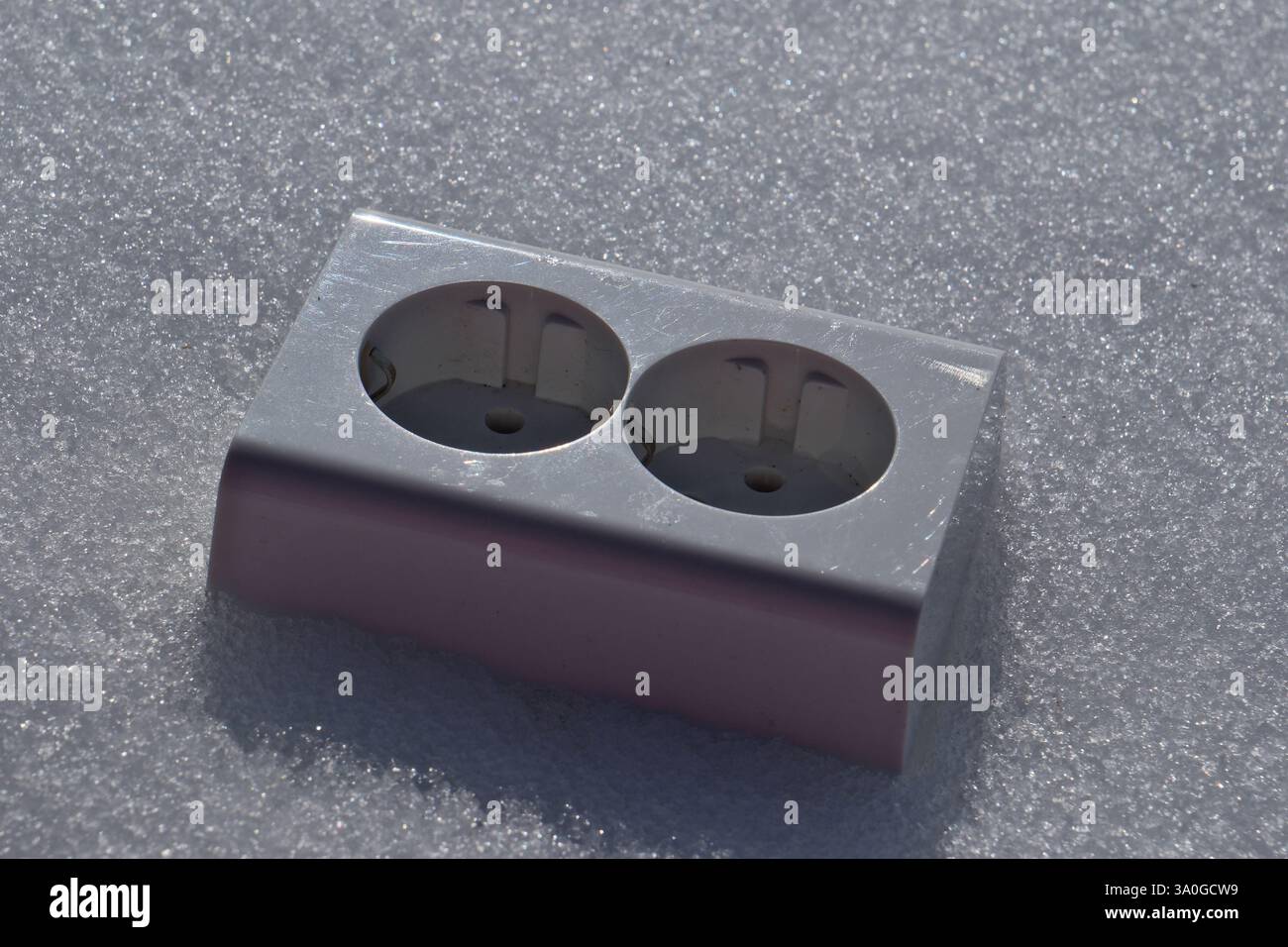 Electrical socket on the snow close-up. Electricity concept. Power ...