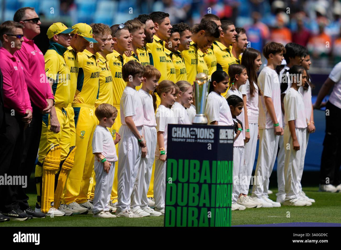 Australian players stand for their national anthem before the start of ...