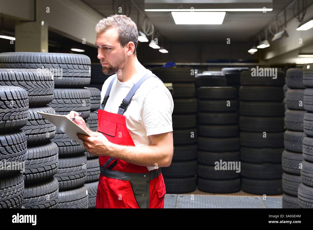 department store with car tyres in a garage - tyre change Stock Photo ...