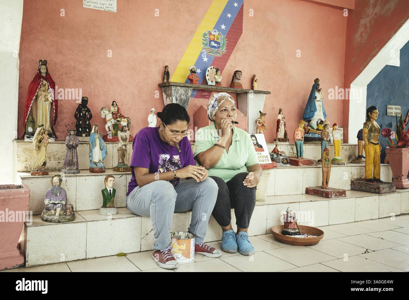 Two woman smoking cigars at the grave of the social bandit Malandro ...
