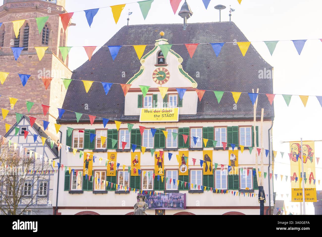 Colourful decorations on a historic town house underline a festive ...