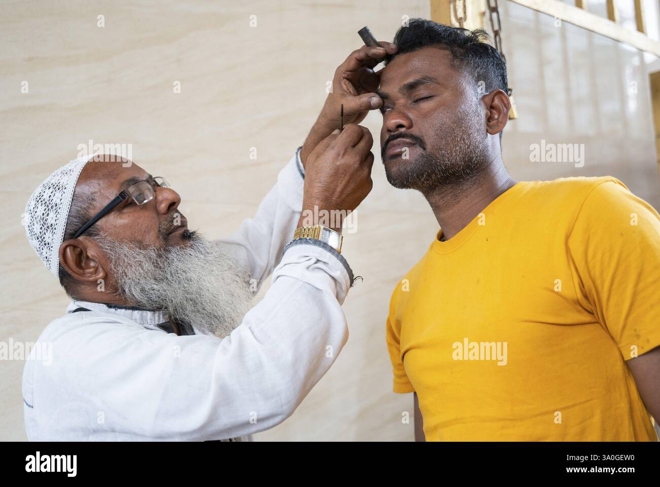 GUWAHATI, INDIA - MARCH 2: A Muslim person gets surma on eyes, as he ...