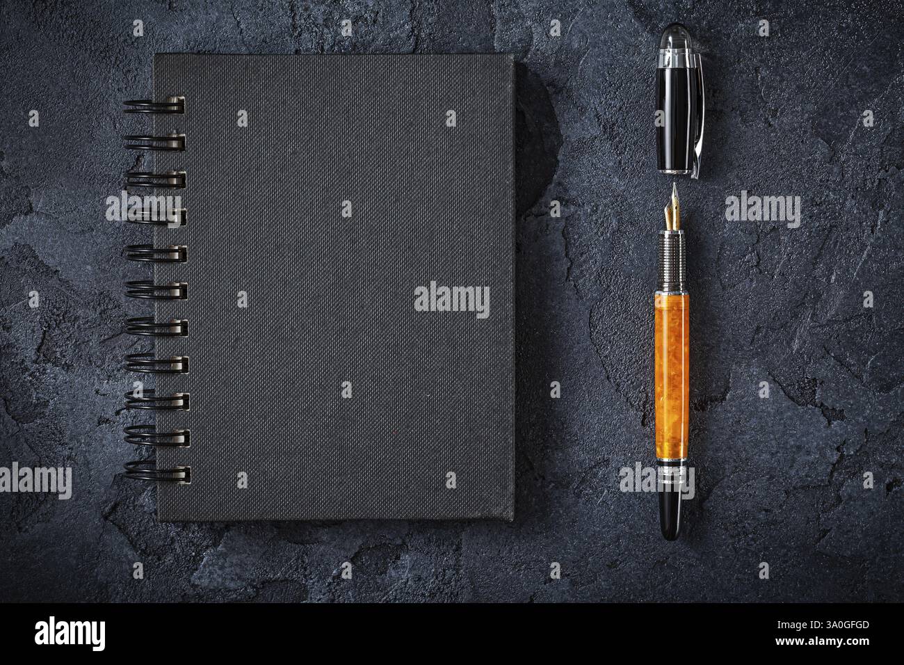 Black Notepad And Fountain Pen On Black Background Stock Photo - Alamy
