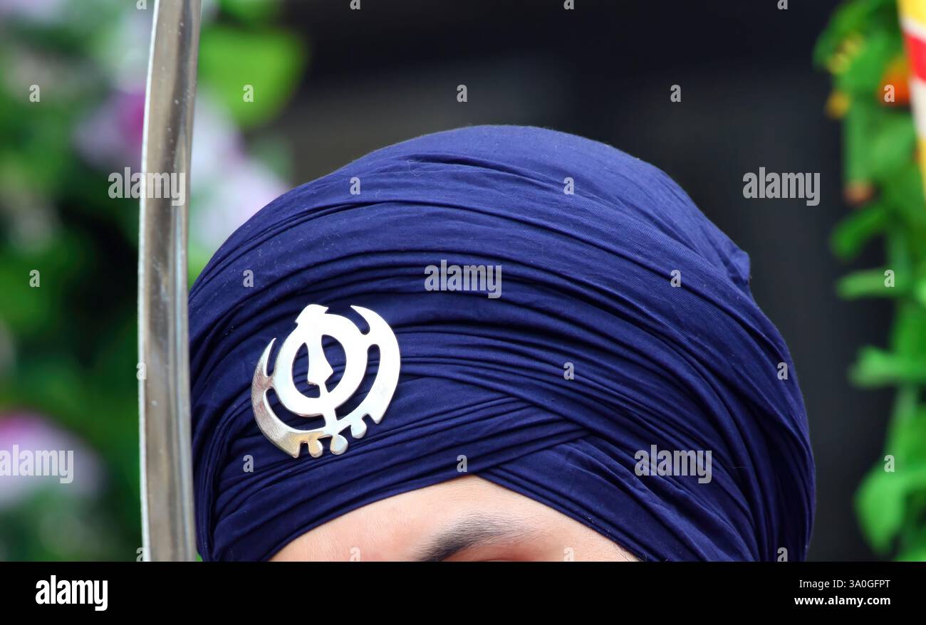 Close up of a Sikh man wearing a traditional blue Dastar - turban ...