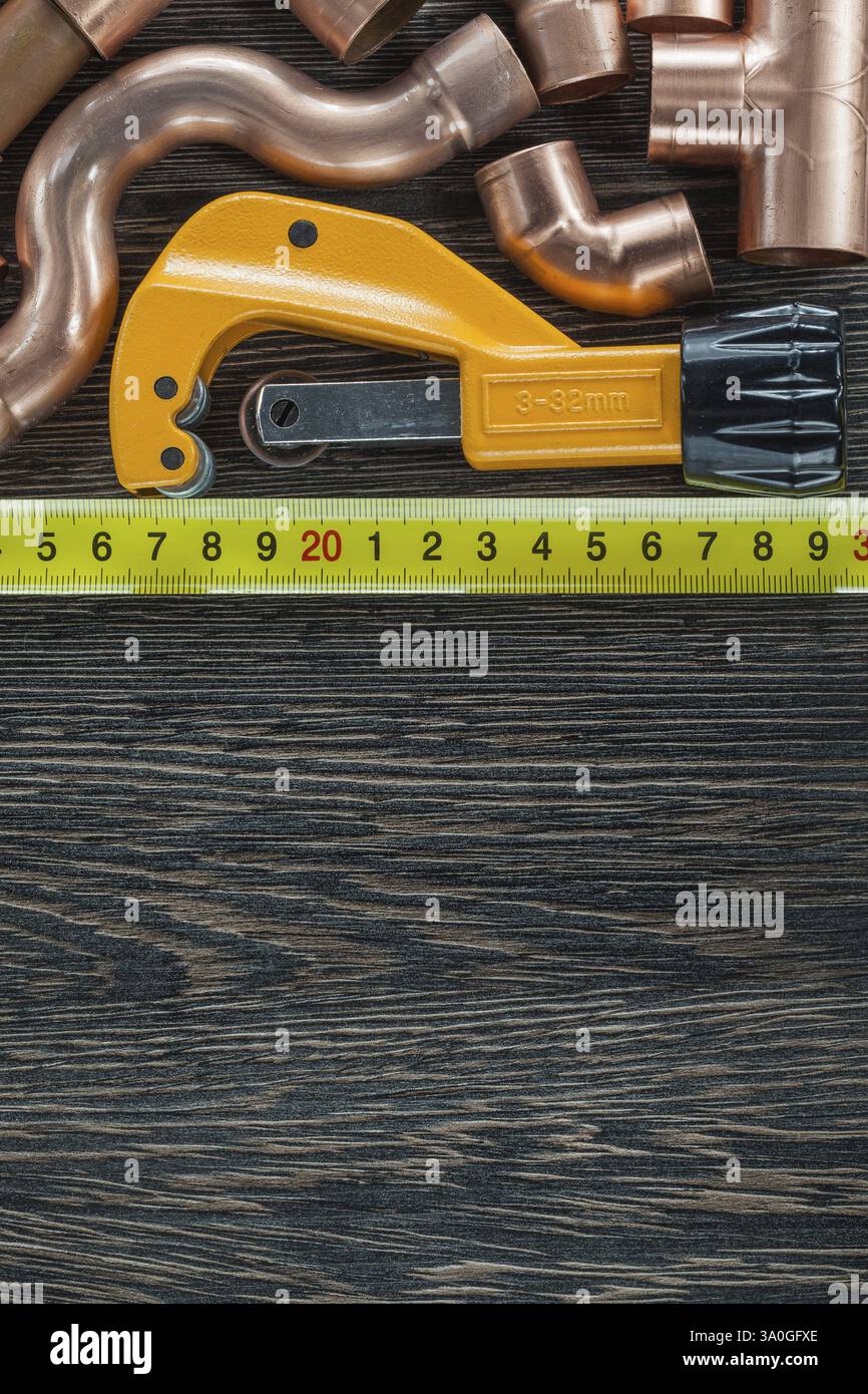 Brass water pipes tape measure pipe scissors Stock Photo - Alamy