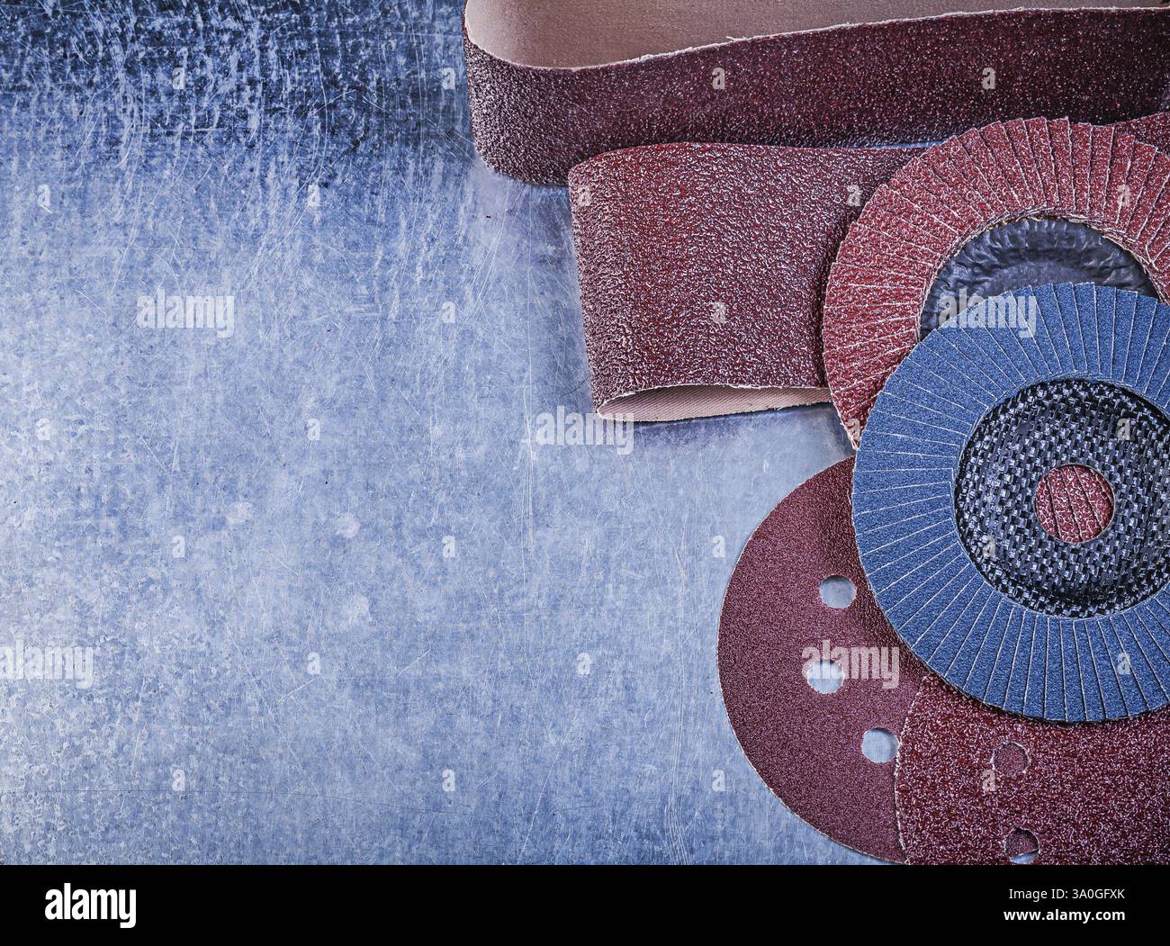 Emery paper abrasive discs flap grinding wheels on metallic background ...