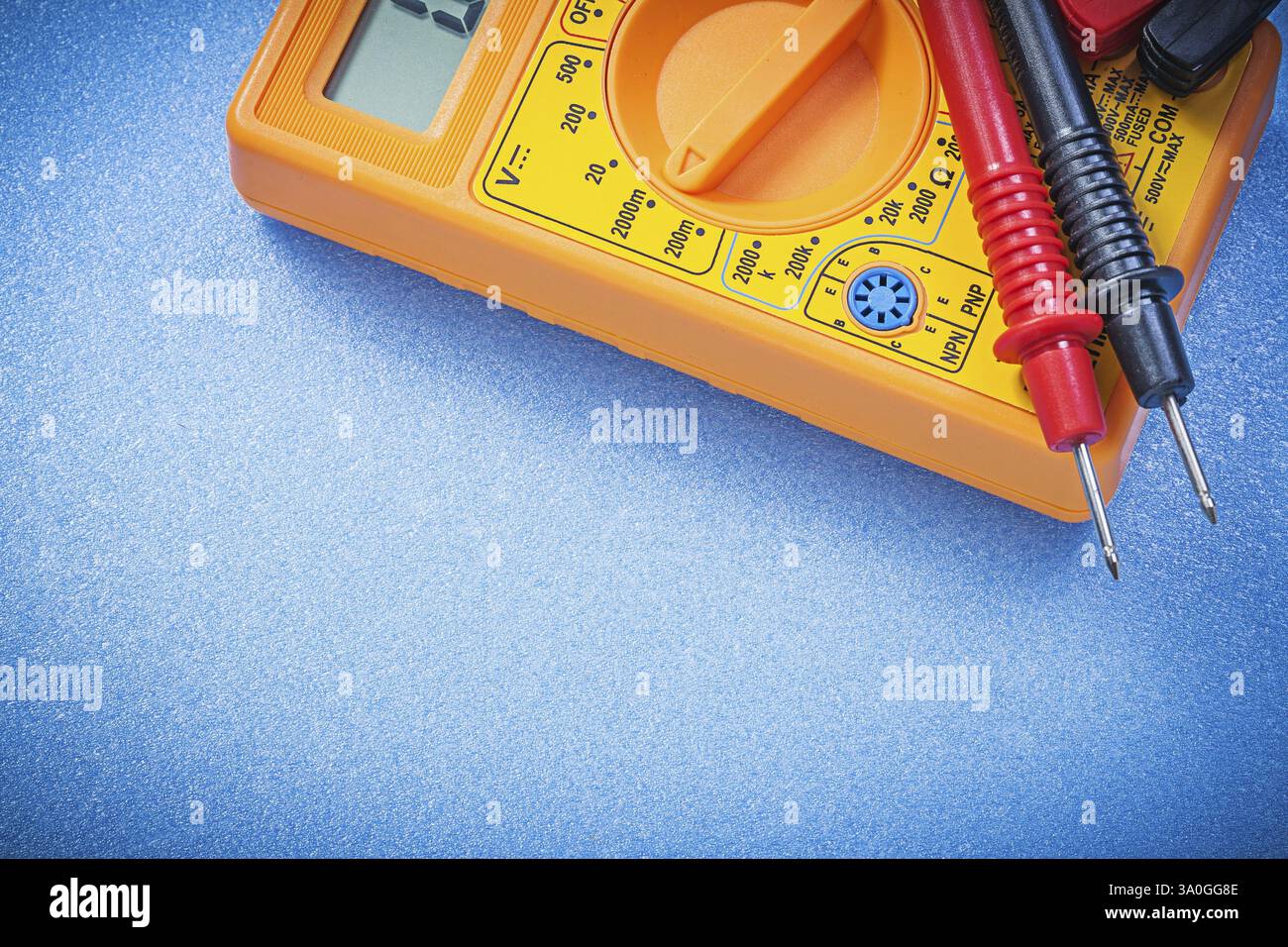 Electric digital multimeter on blue background top view electricity ...