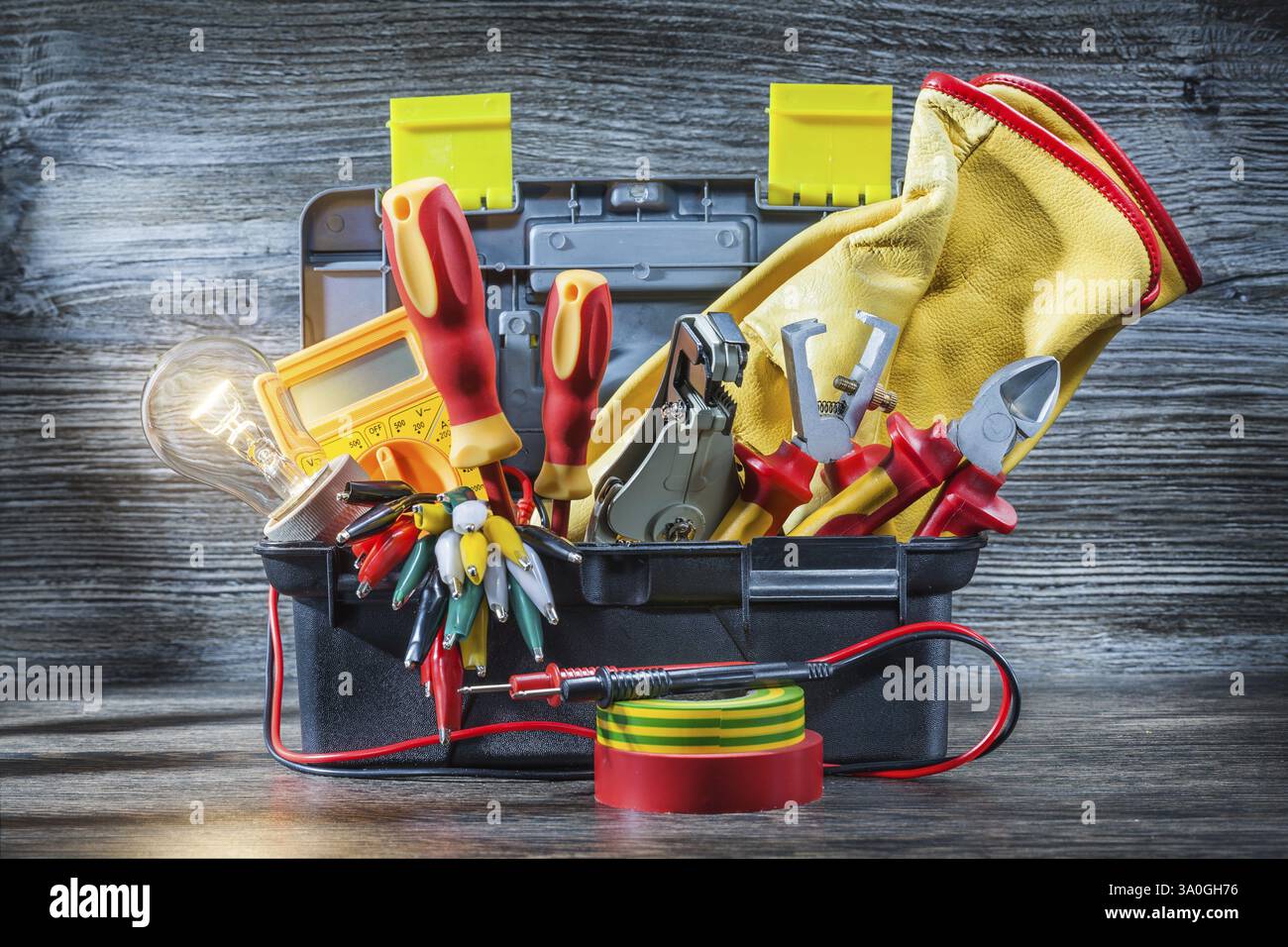 Electric tools set in little toolbox on vintage wood Stock Photo - Alamy