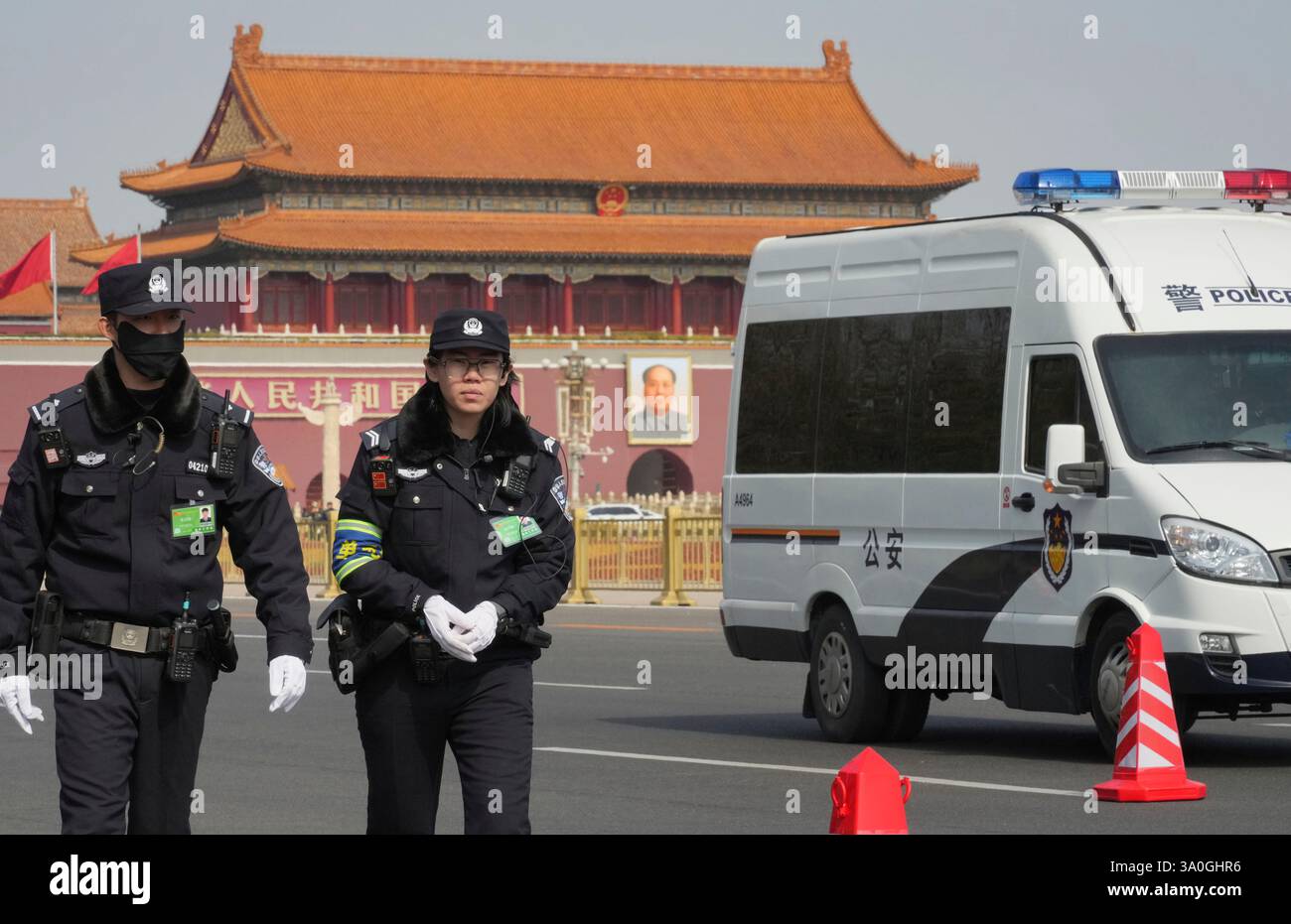 Police officers guard around the Great Hall of the People in Beijing ...