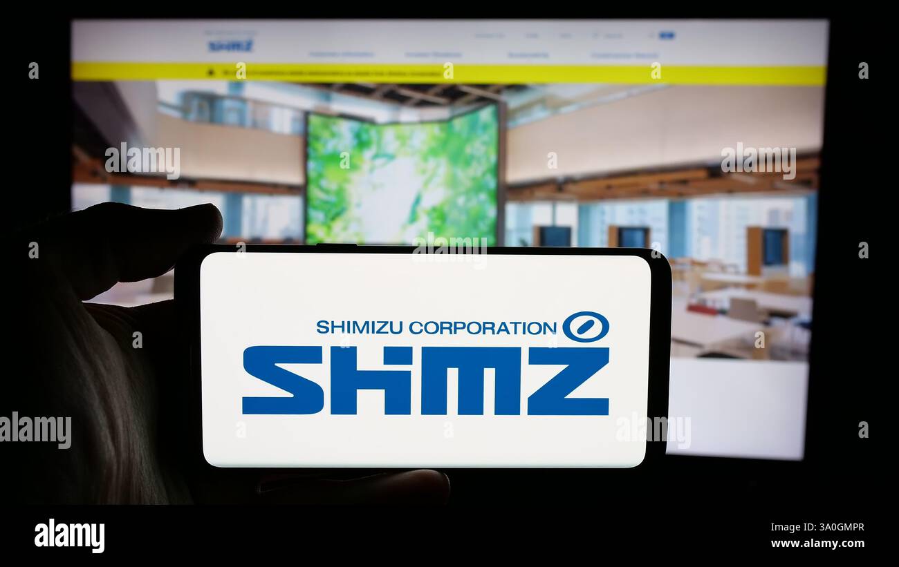 In this photo illustration, a person is holding a cellphone with the ...