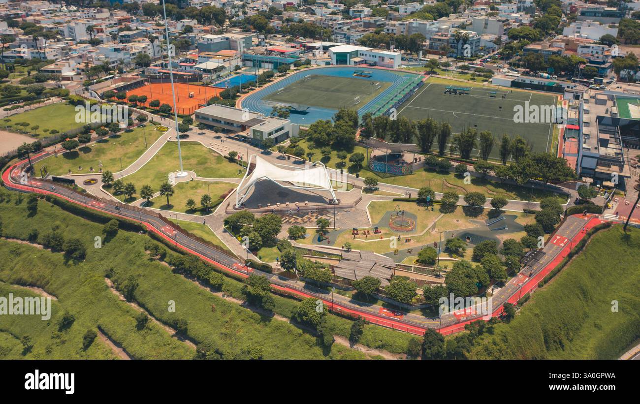 Modern sports complex with running track, soccer field, and playground ...