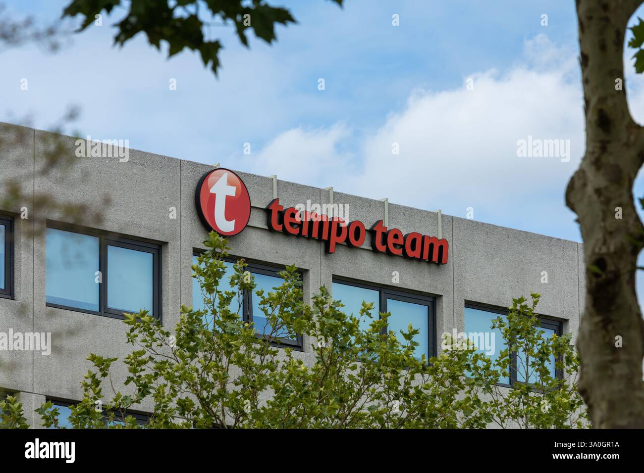 Tempo team logo sign at the office building. Tempo-Team is a broad HR ...