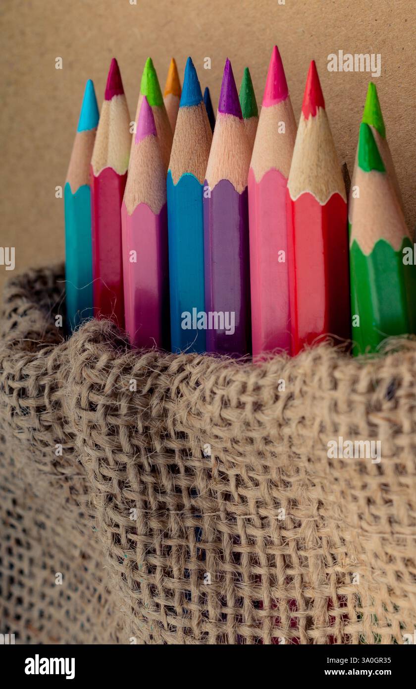 Color Pencils in a linen sack on canvas Stock Photo - Alamy