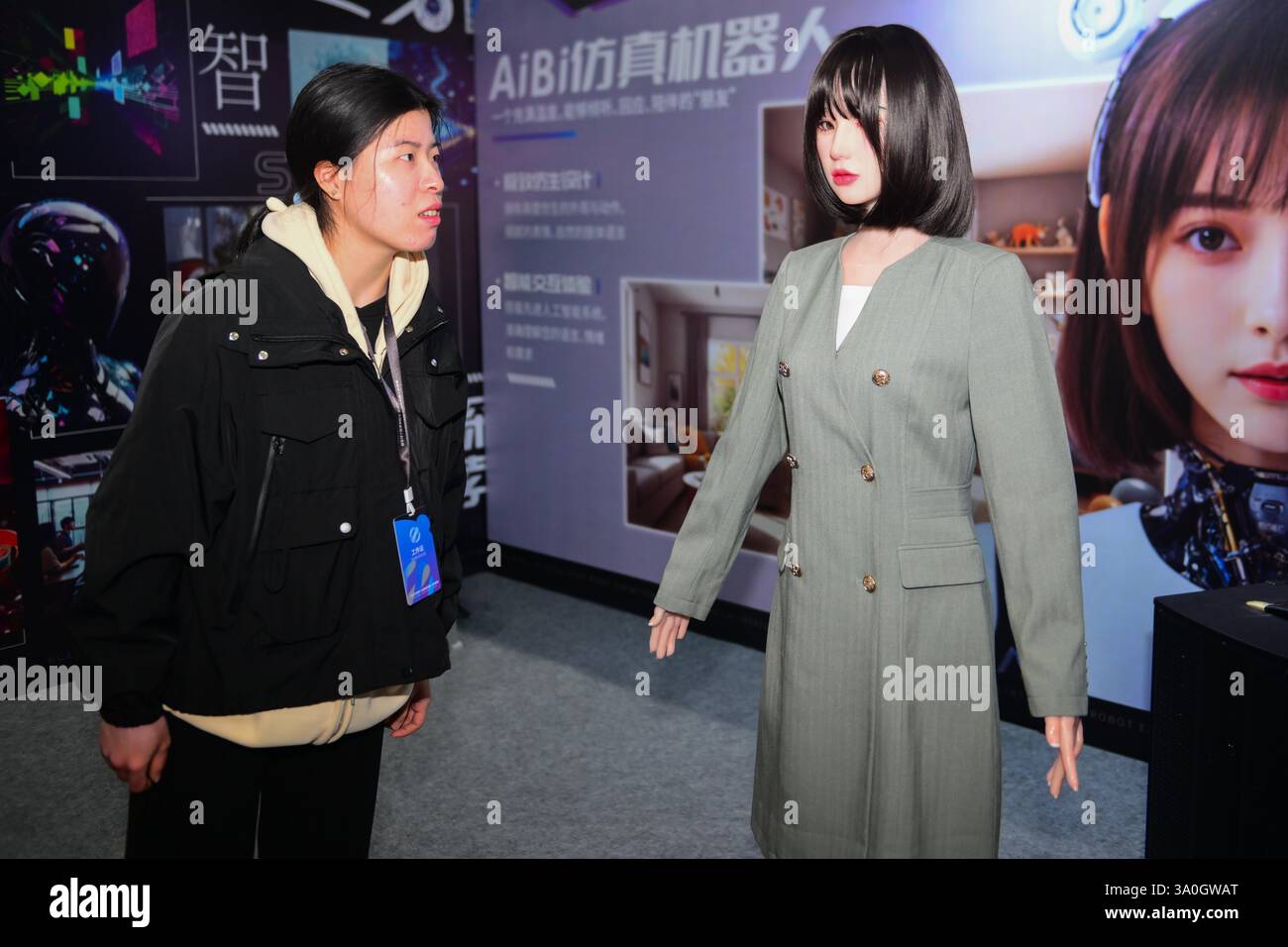 People visit an AI robot popularization exhibition in Suzhou City, east ...