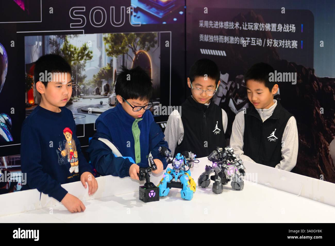 People visit an AI robot popularization exhibition in Suzhou City, east ...