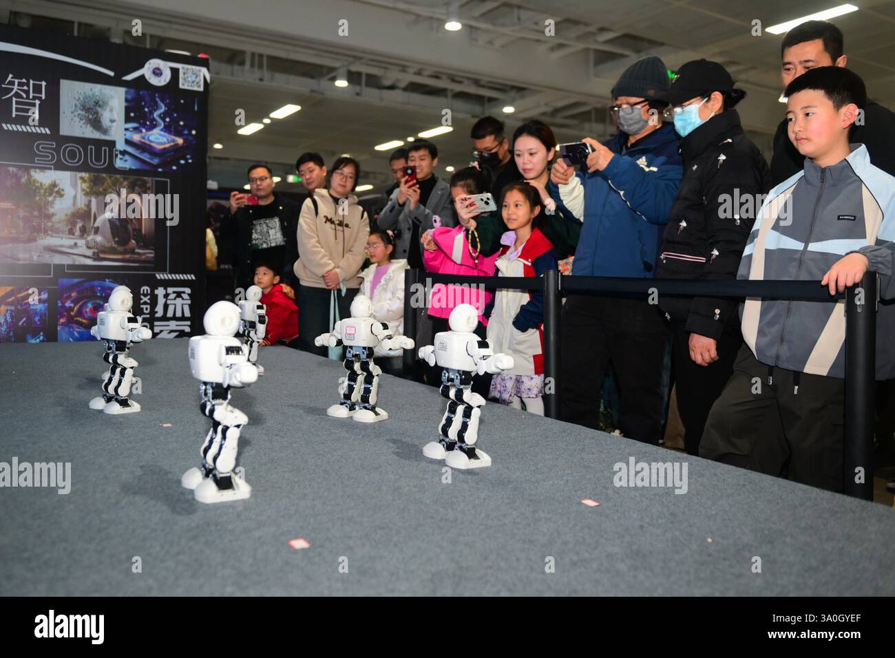People visit an AI robot popularization exhibition in Suzhou City, east ...