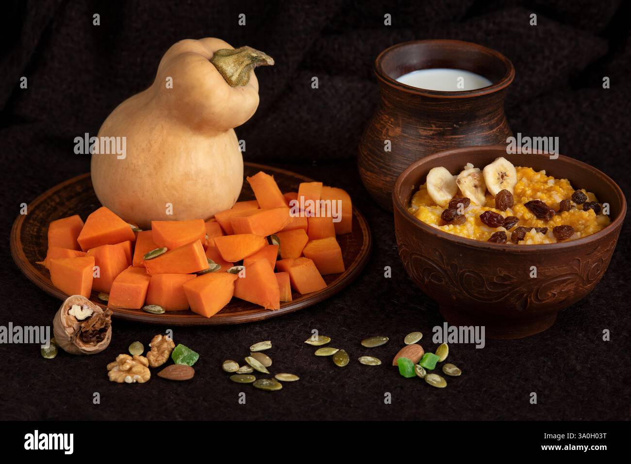 Rice porridge cooked in milk with pumpkin and millet, with butter ...