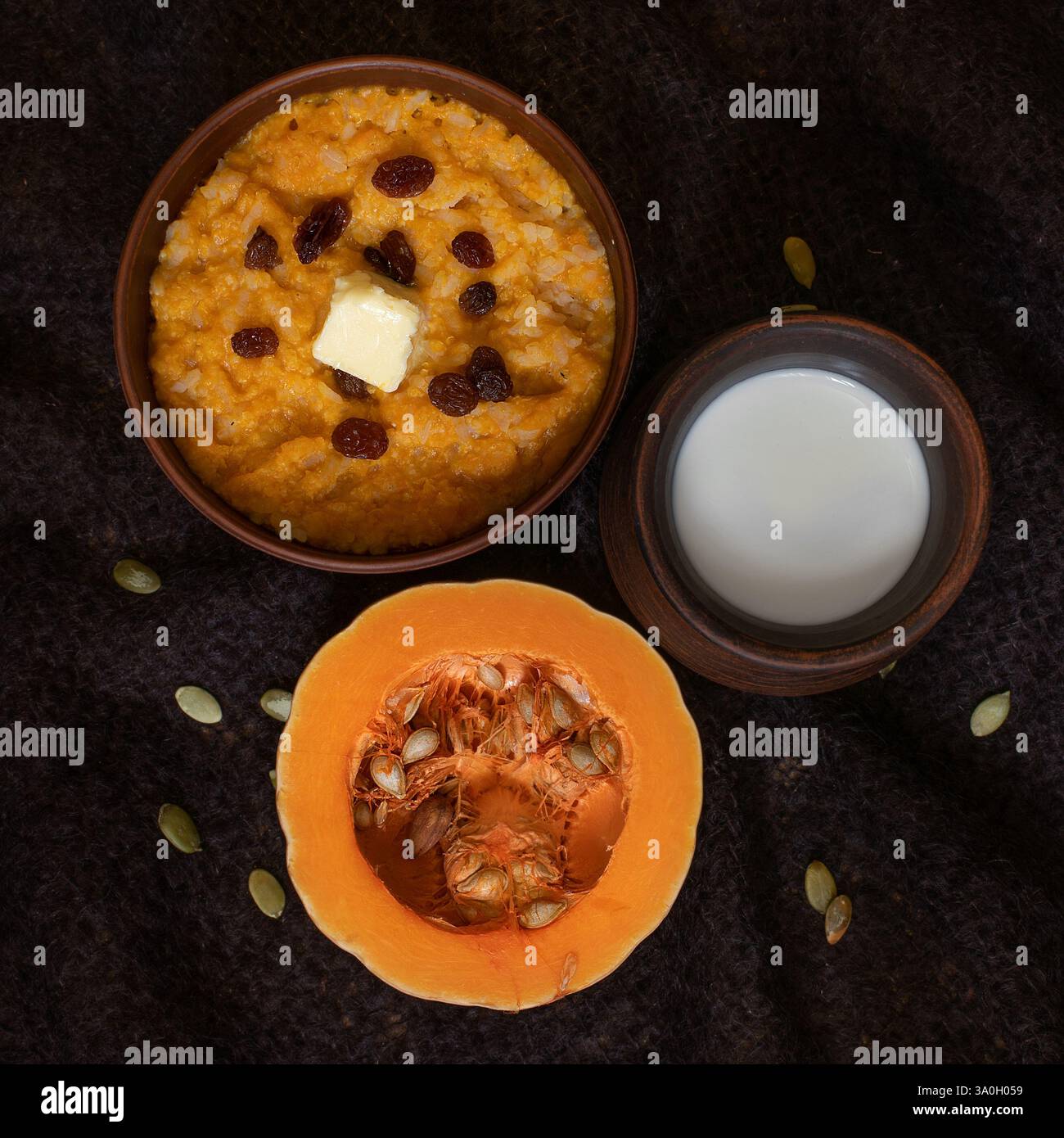 Rice porridge cooked in milk with pumpkin, millet, butter, raisins ...
