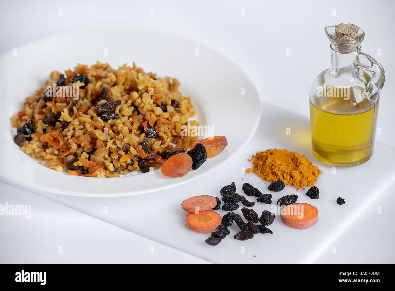 Sweet pilaf with dried apricots, carrots, prunes, raisins and turmeric ...