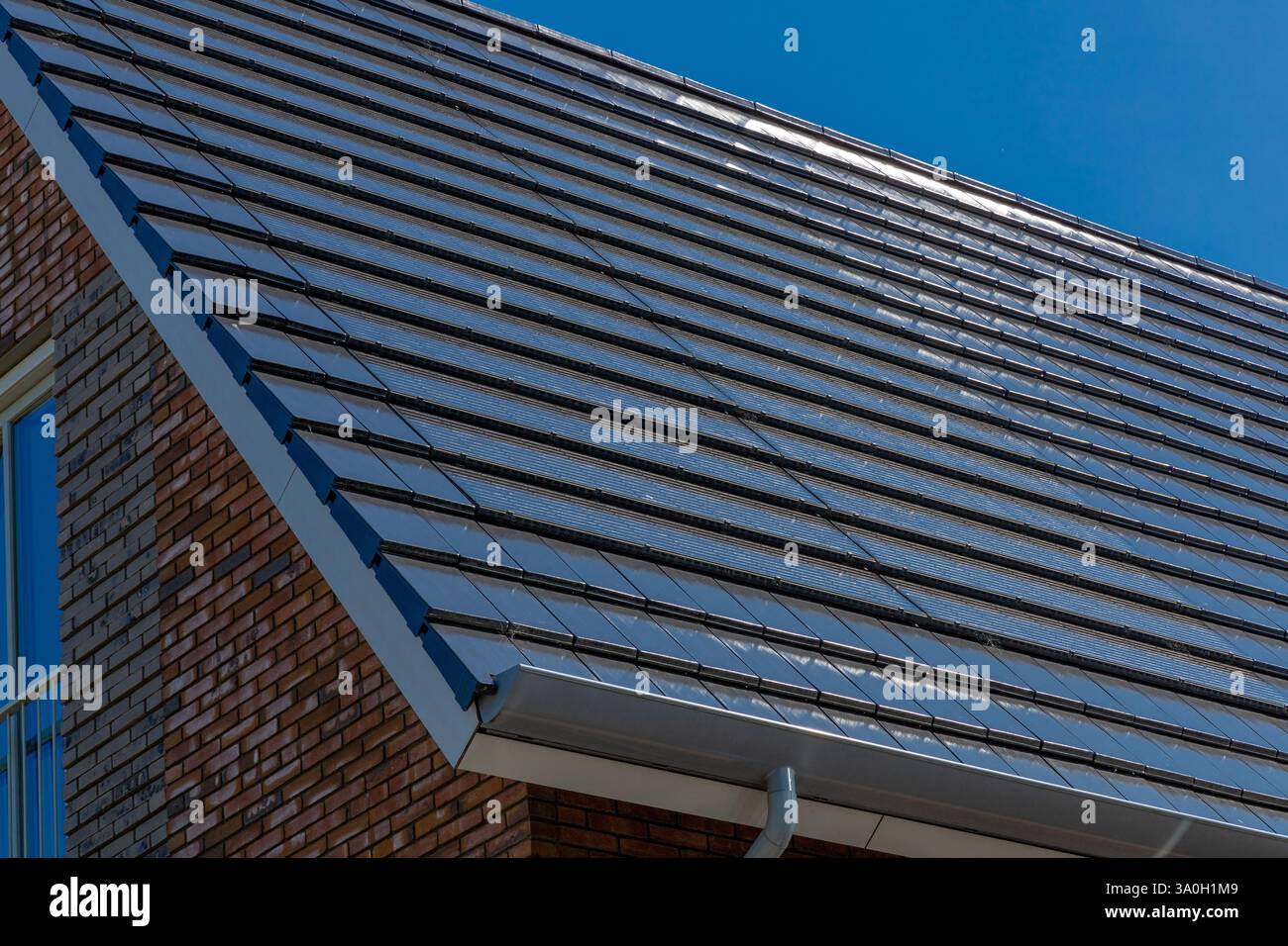 Integrated solar panels close up. Photovoltaic panels in the roof ...