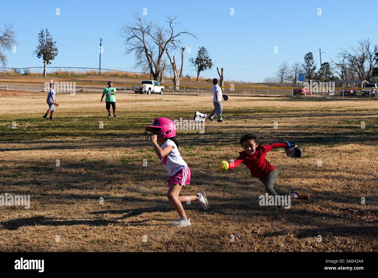 Layla Cortez, 6, right, tries to tag out Jaylee Cruz, 7, as they ...