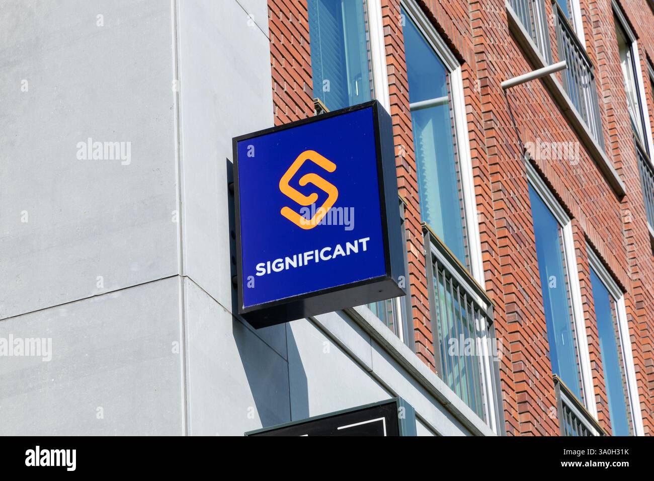 Significant logo sign hanging on the wall Stock Photo - Alamy