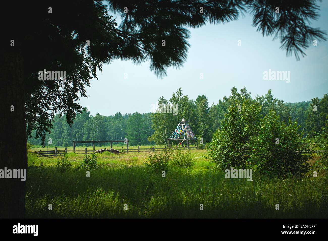 This photograph depicts a tranquil countryside scene with a large ...