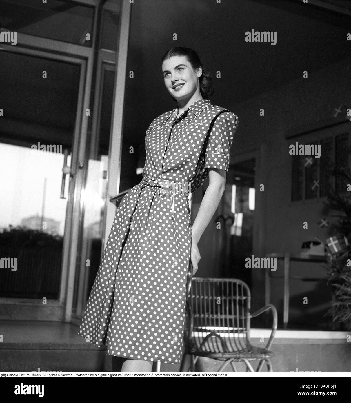 Fashion 1946, a young female model dressed in the fashion of the post ...