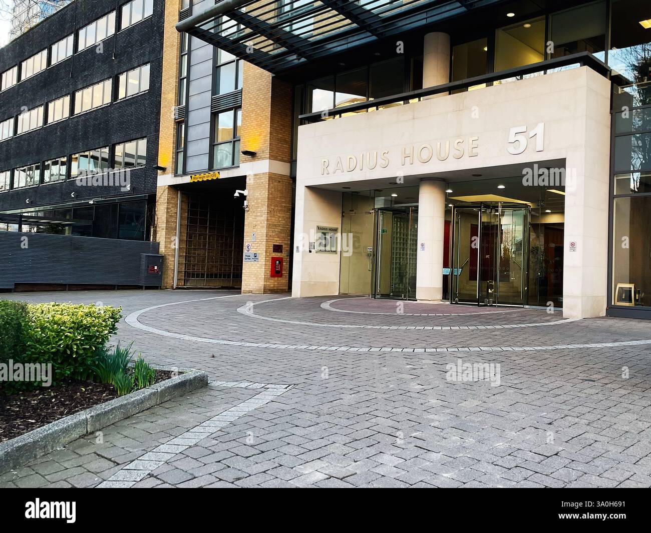 London, UK - March 02, 2025: Glass entrance of an urban office Radius ...
