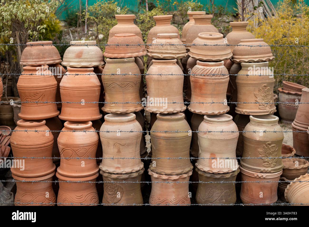 Clay pots for plants in a garden store Stock Photo - Alamy