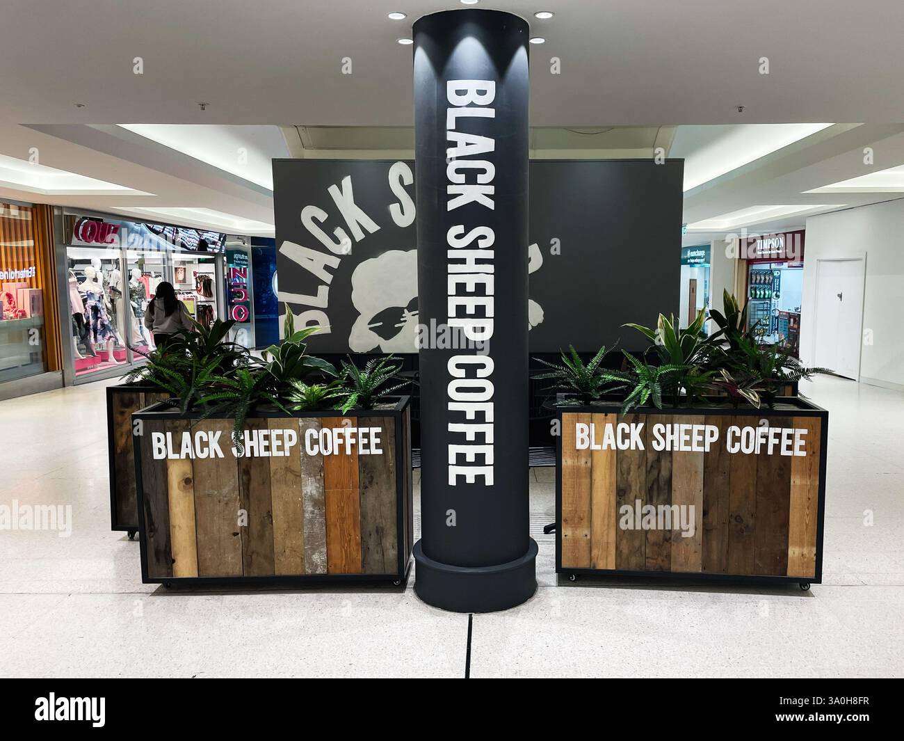London, UK - March 02, 2025: Contemporary Black Sheep coffee shop kiosk in a mall with stylish ...