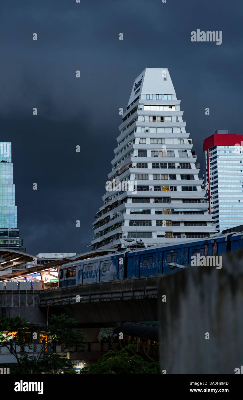 This evocative dusk image features the iconic Sathorn Unique Tower, a ...