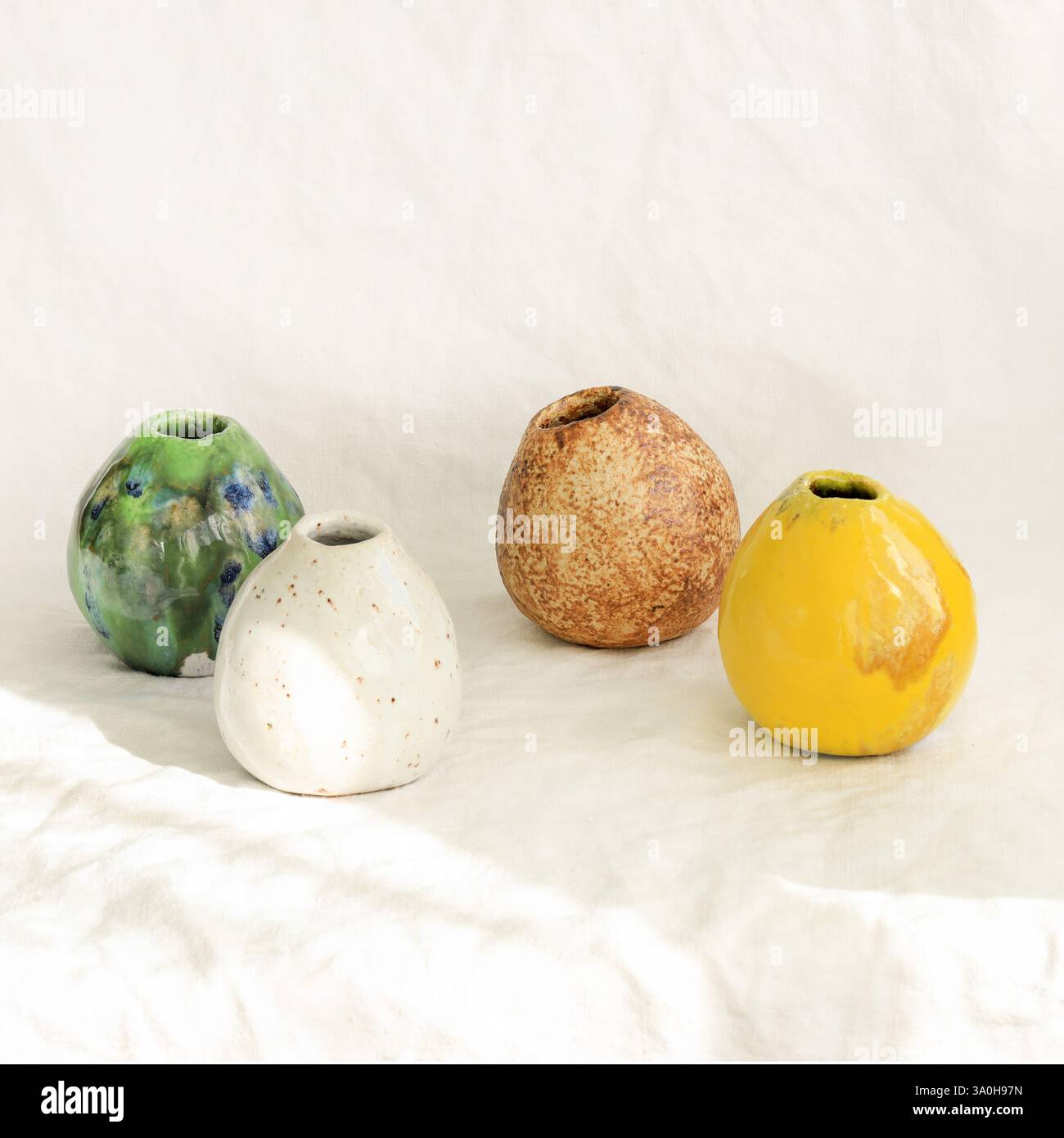 Set of handmade ceramic vases. Different small glazed vases. Interior ...