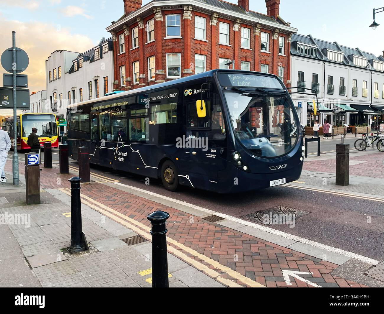 London, UK - March 02, 2025: A city bus traveling along an urban street ...
