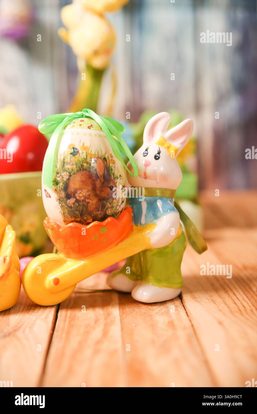 Easter decoration with a ceramic Easter bunny Stock Photo - Alamy