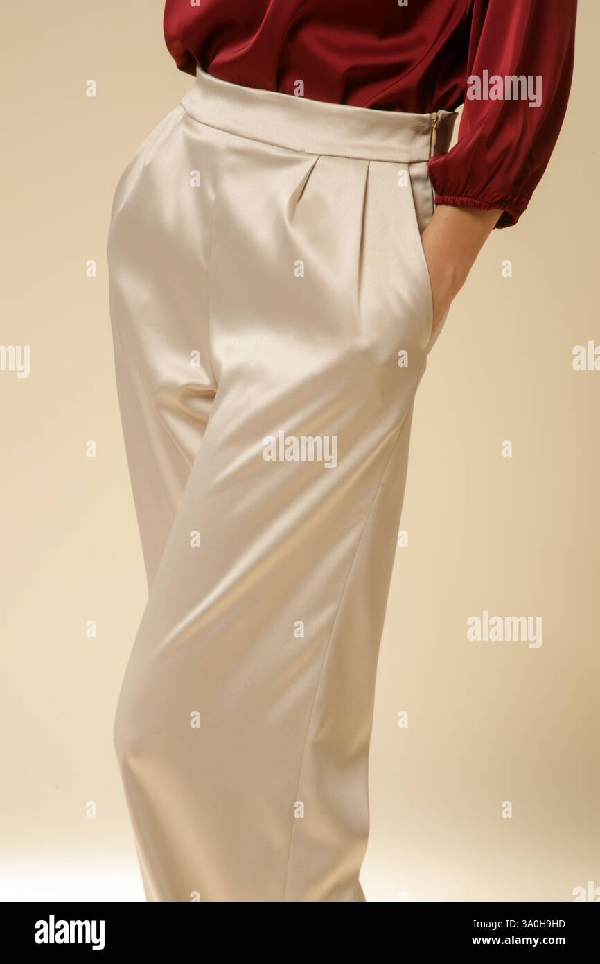 Serie of studio photos of young female model wearing basic high waist ...