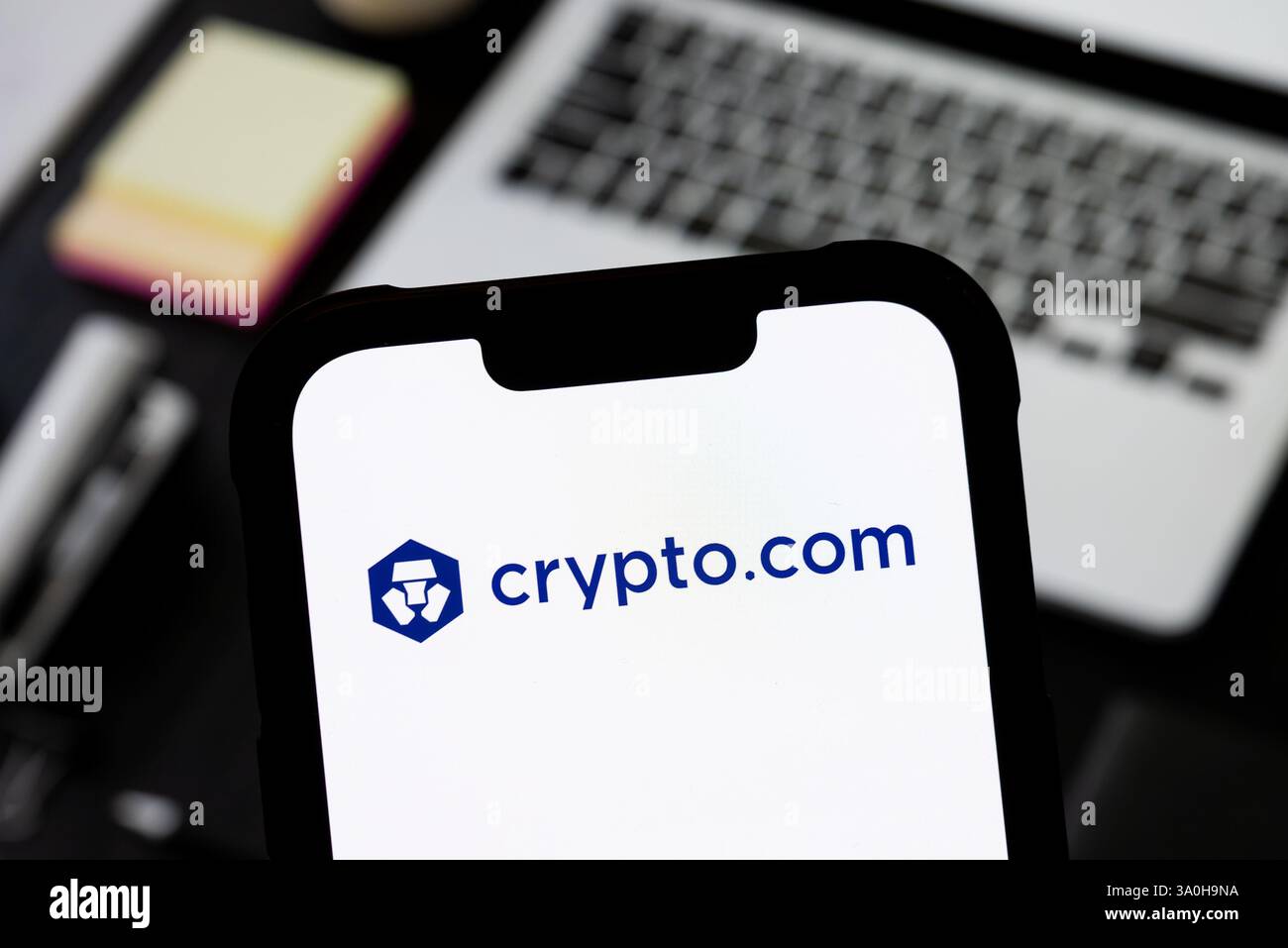 In this photo illustration, a Crypto.com logo is seen displayed on a ...