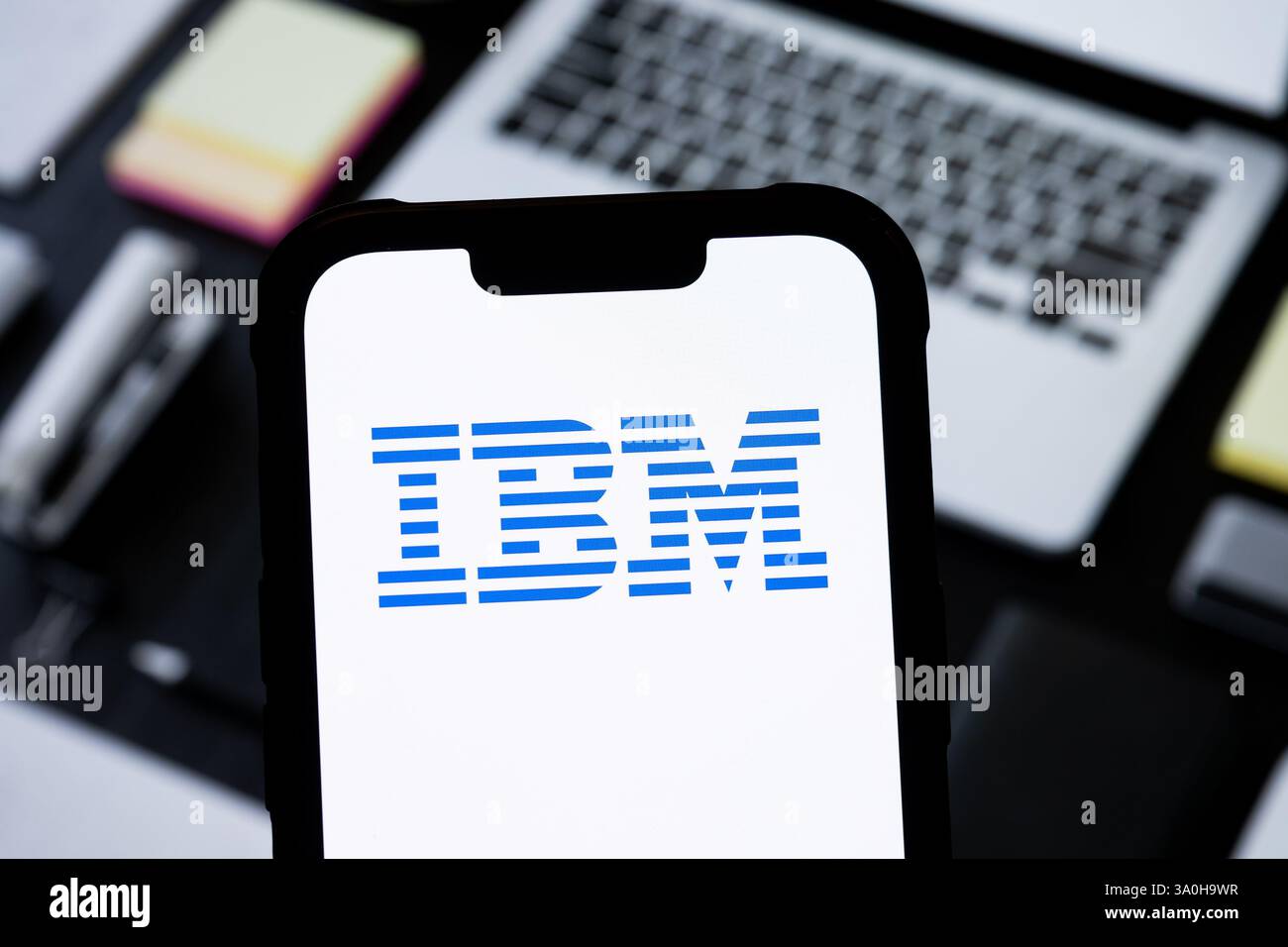 In this photo illustration, a IBM logo is seen displayed on a ...