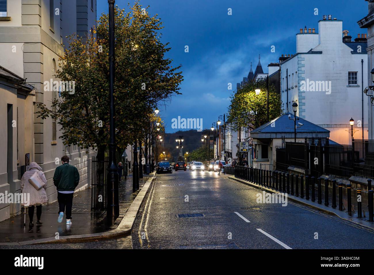 Street with cars and people walking at night, Derry, Ireland Stock ...
