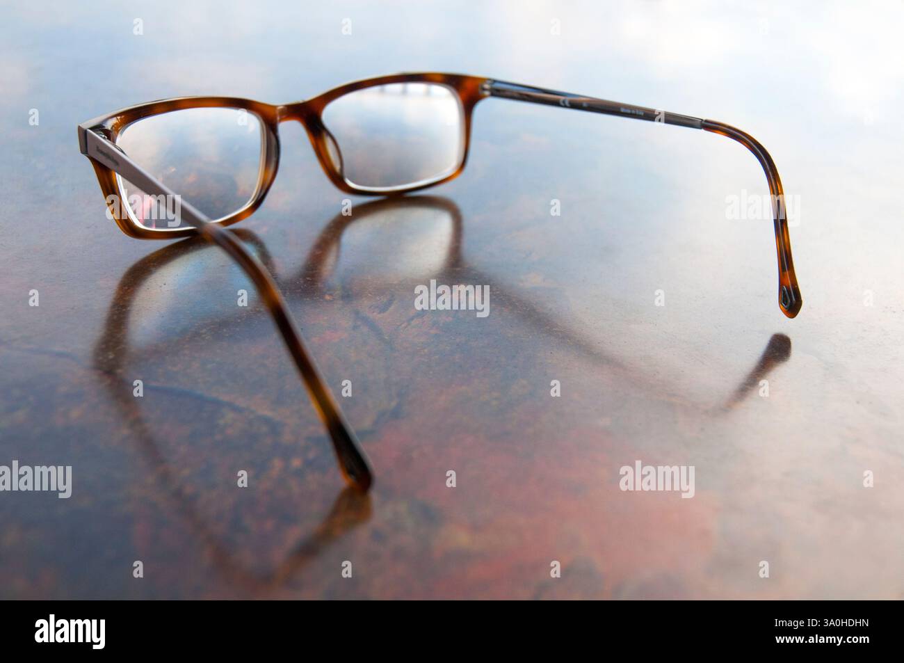 Eyeglasses and its reflection on marble surface Stock Photo - Alamy