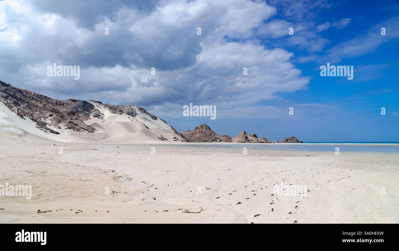 Vast sandy terrain meets turquoise waters in Socotra, showcasing unique ...