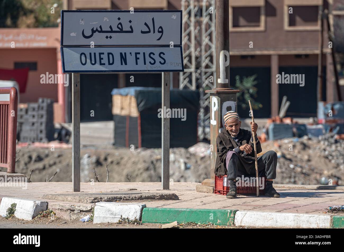 Atlass Mountains, Morocco - February 16, 2025: Elderly man sits with a ...