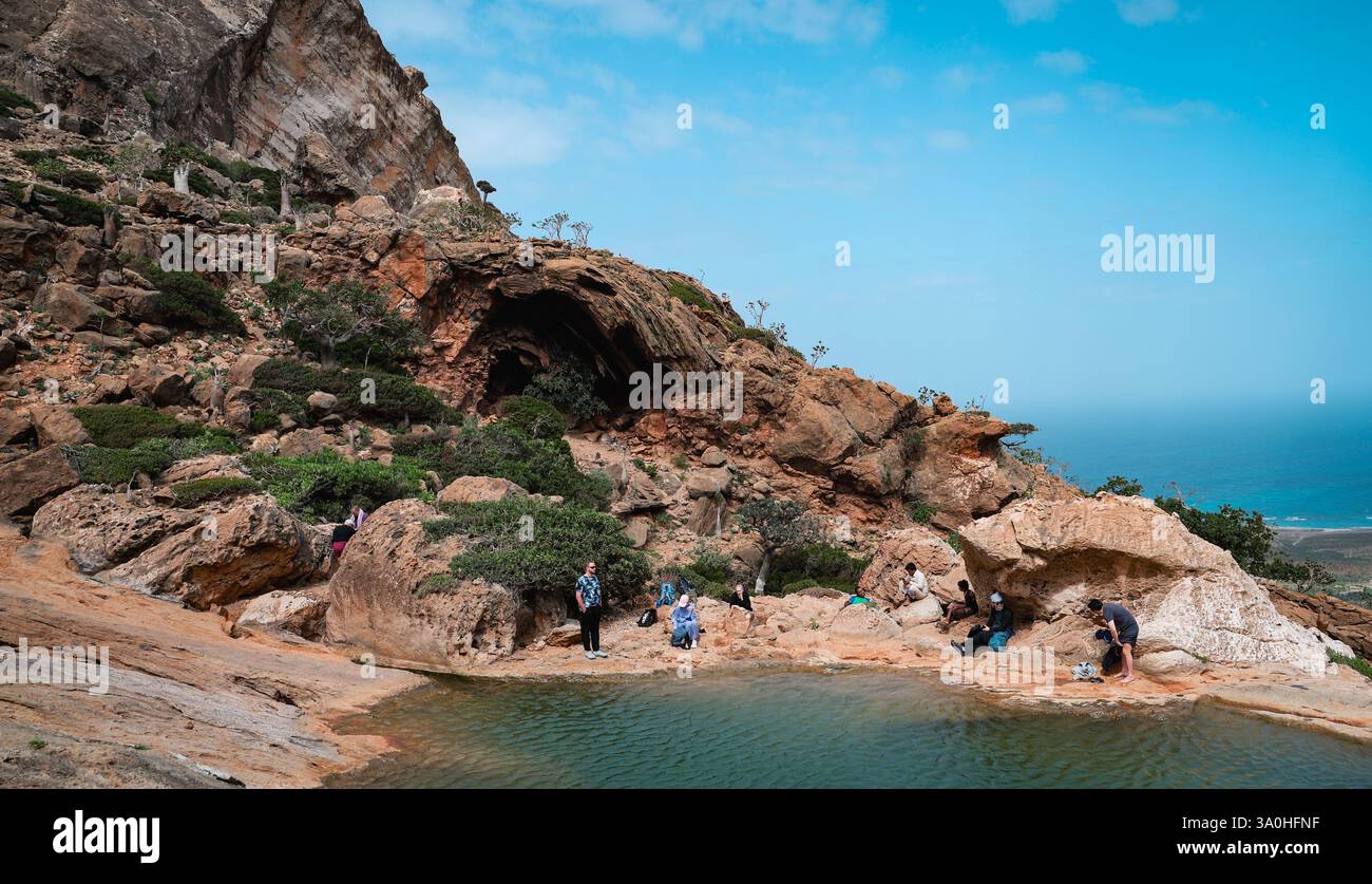 Tourists enjoy a unique outing by natural pools in Socotra, surrounded ...