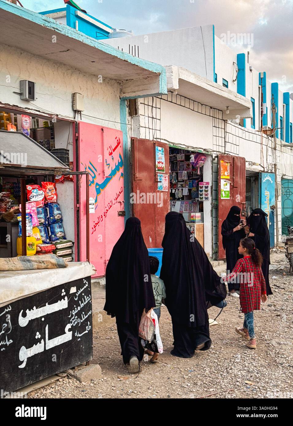 Women dressed in traditional attire accompany children while exploring ...