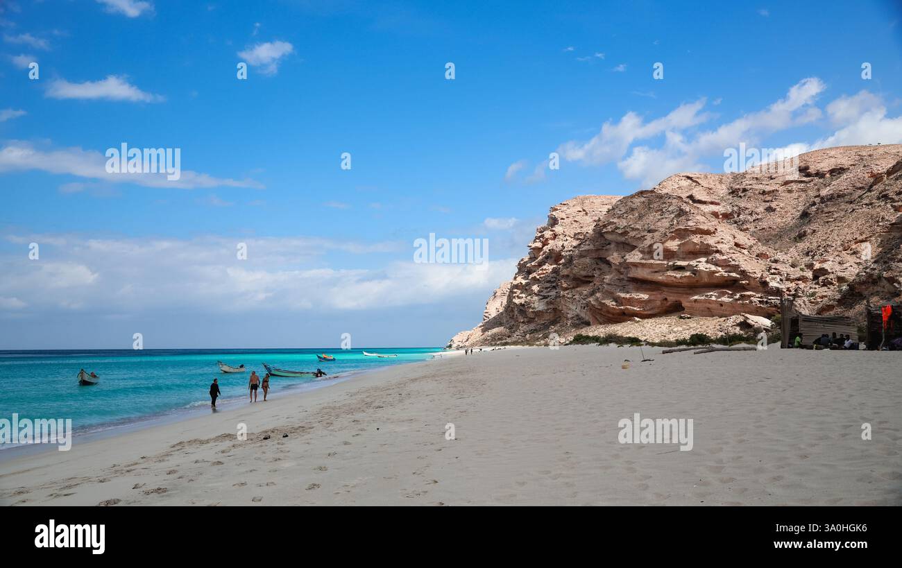 Visitors enjoy the beautiful sandy beach and turquoise waters of Shoab ...