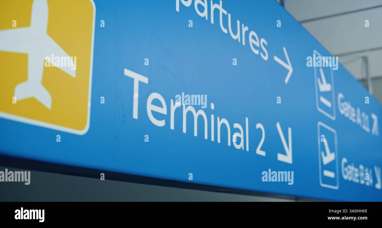 Close Up of Big Navigation Sign Hanging on Ceiling Directing Passengers ...