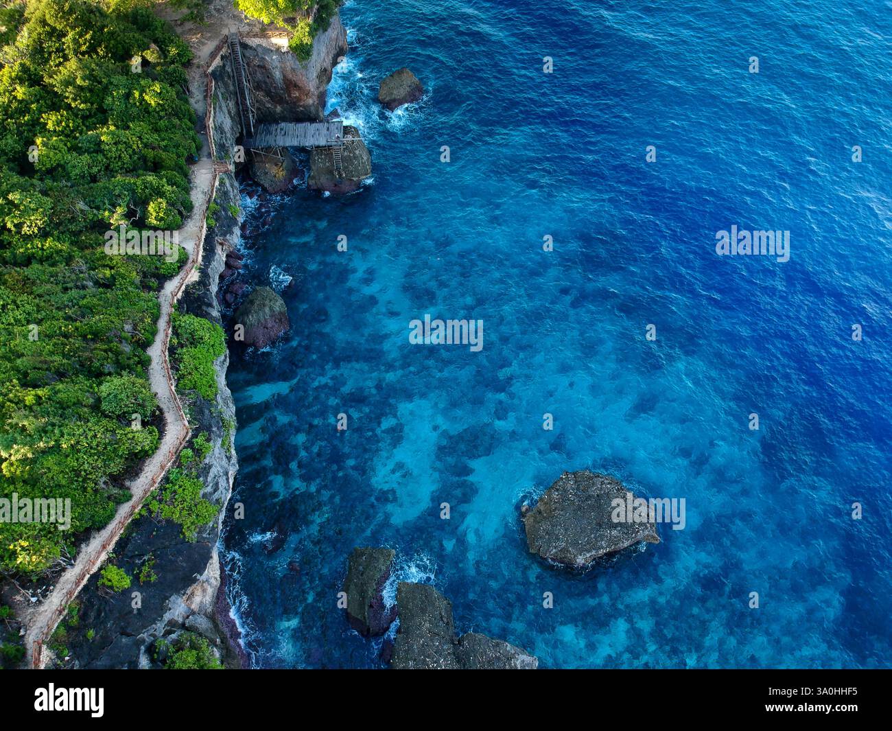 Aerial view Top down seashore. Waves crashing on rock cliff. Beautiful ...