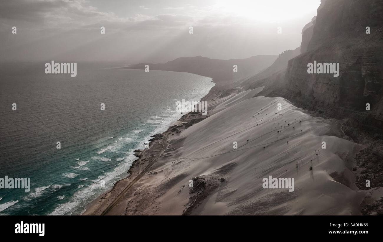 Vast white sand dunes meet the azure sea as visitors explore Socotras ...