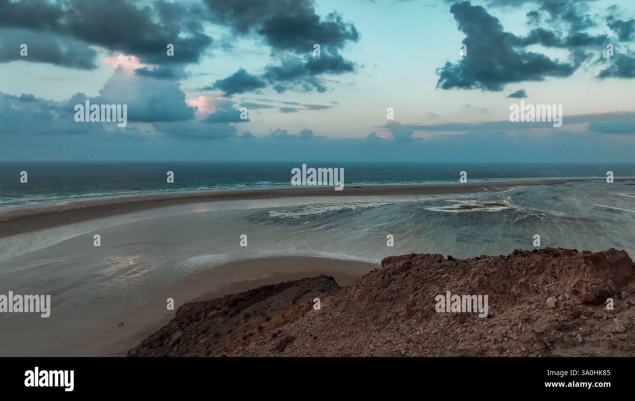 Vast sand banks and rugged cliffs meet the azure waters in Socotra ...
